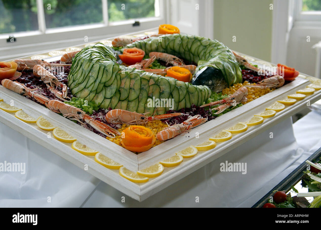 Two dressed Salmon fish with King Prawns at a buffet Stock Photo - Alamy