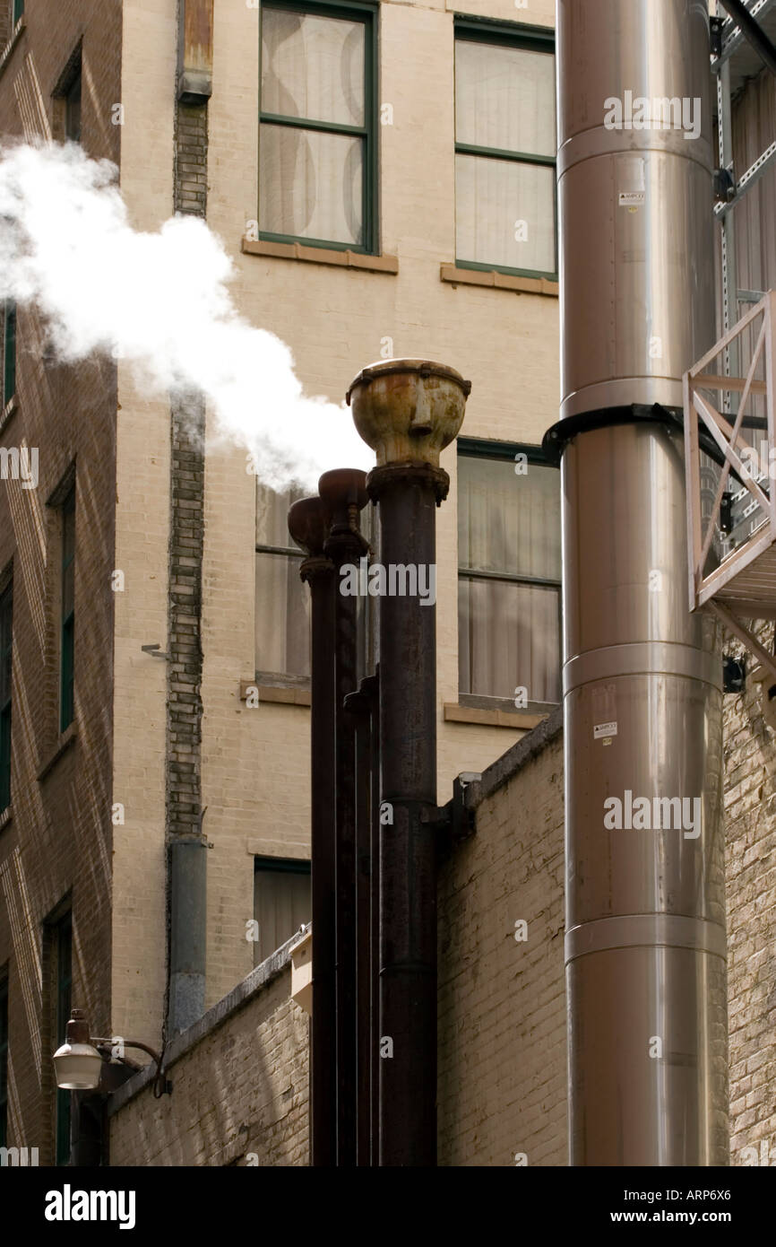 Steam stacks alley old building Stock Photo - Alamy