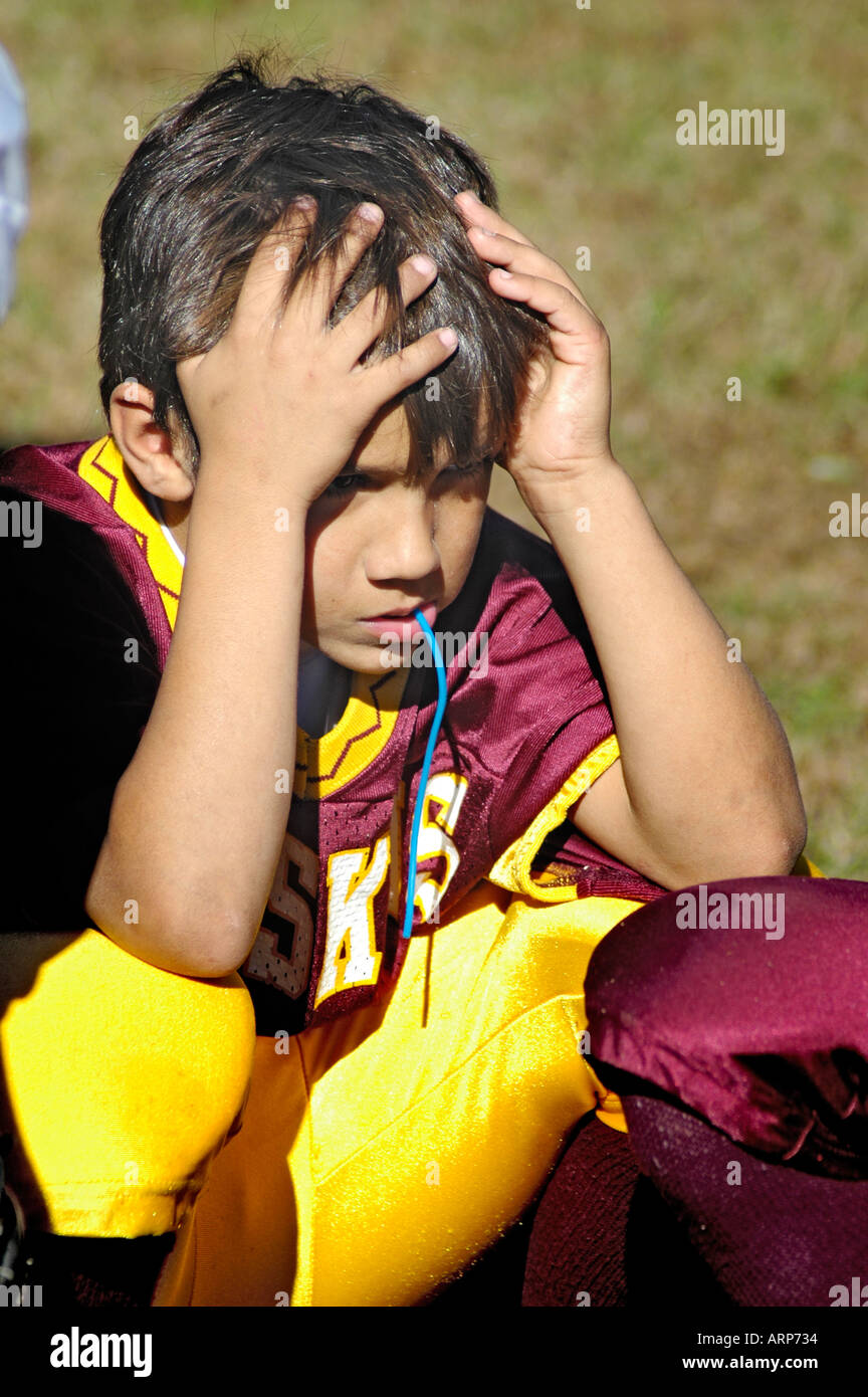 Young football player during loss of game Stock Photo - Alamy
