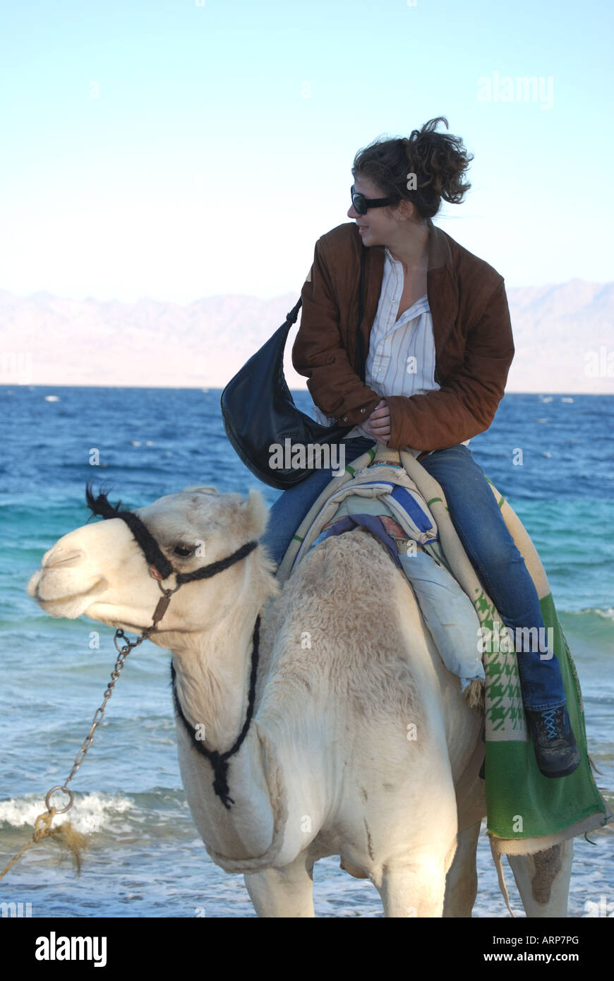 Woman riding camel hi-res stock photography and images - Alamy