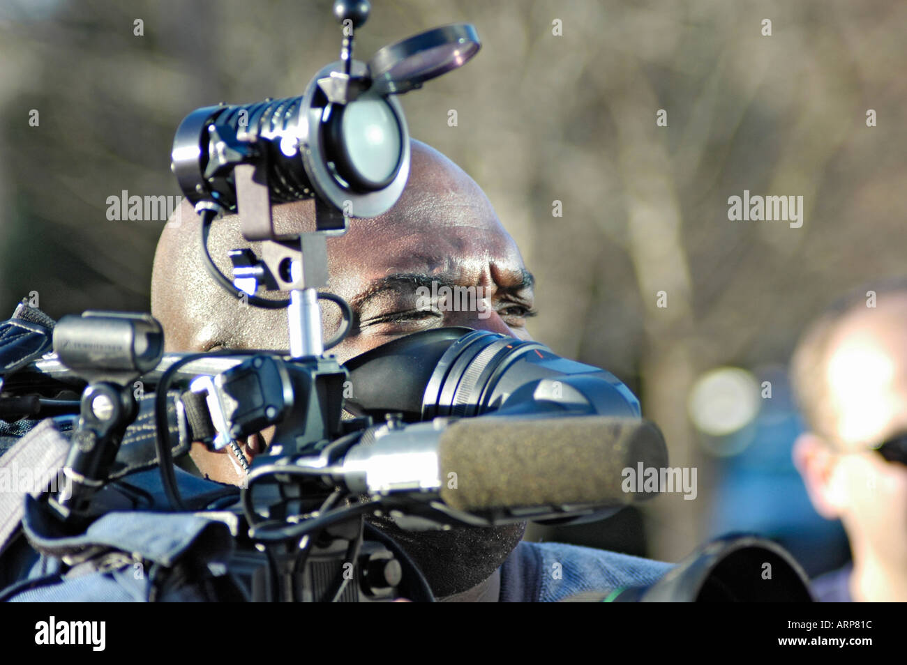 Television cameraman, black photojournalist in Atlanta, FOX at event ...