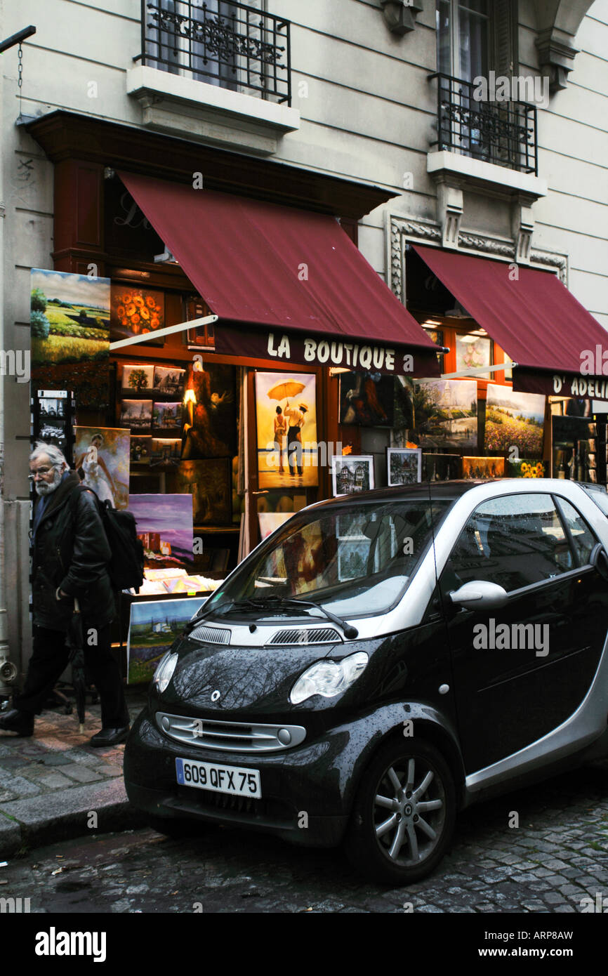 A Smart car parked outside a shop in the Rue des Saules Montmartre ...
