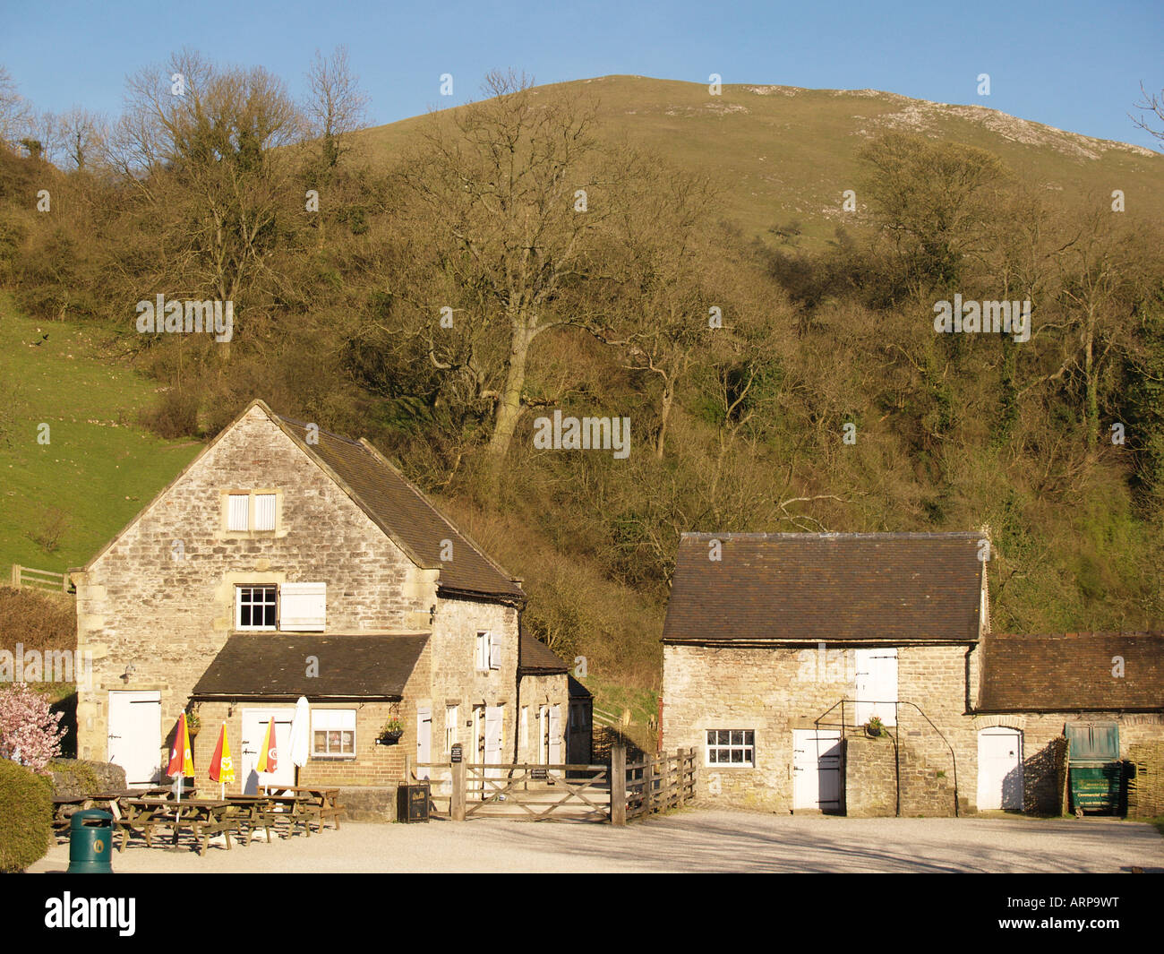 converted farmhouse farm buildings in valley hills Stock Photo - Alamy