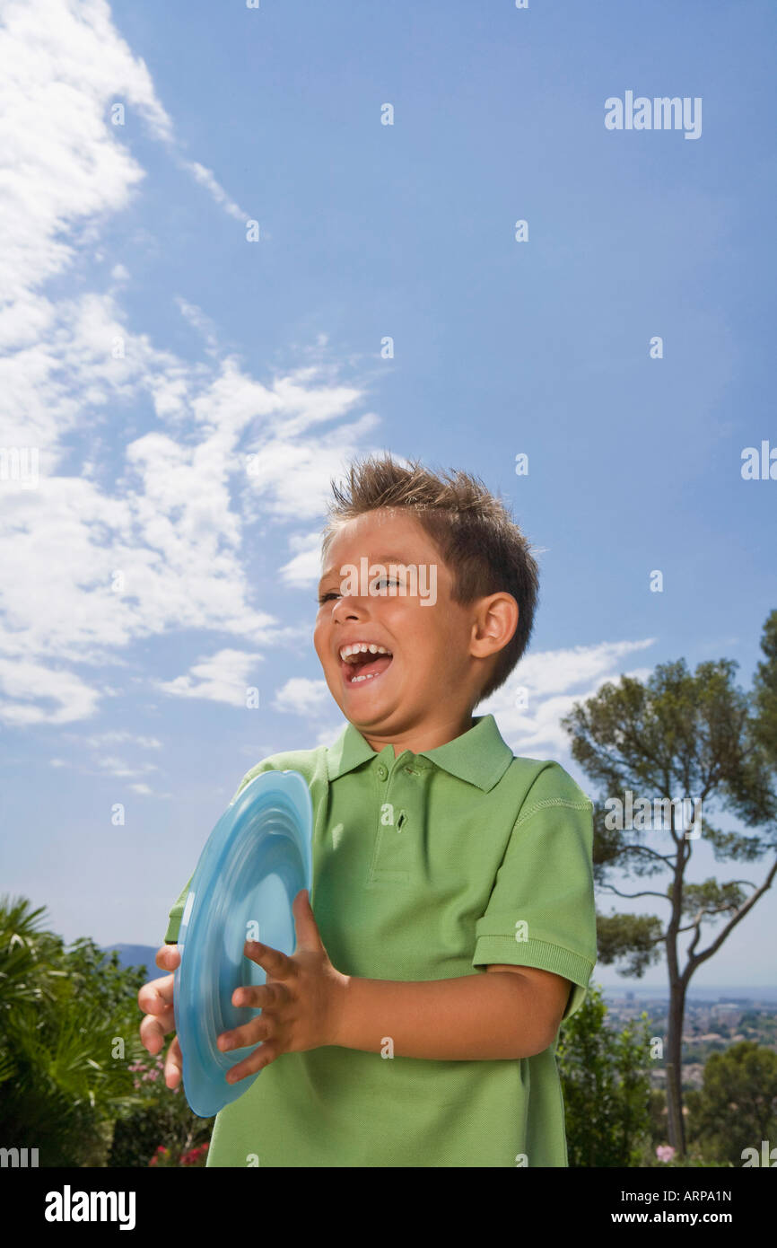 Boy holding Frisbee Stock Photo - Alamy