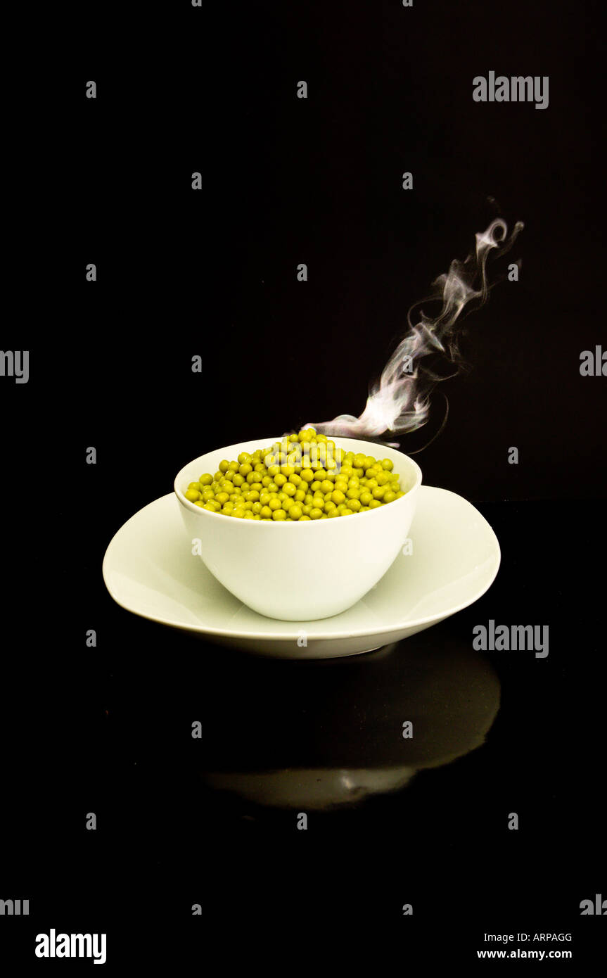 Bowl of hot steaming peas Stock Photo - Alamy