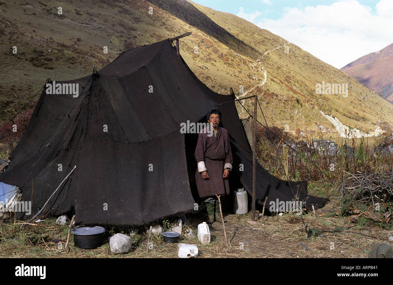 Bhutanese yak herder beside tent hi-res stock photography and images ...