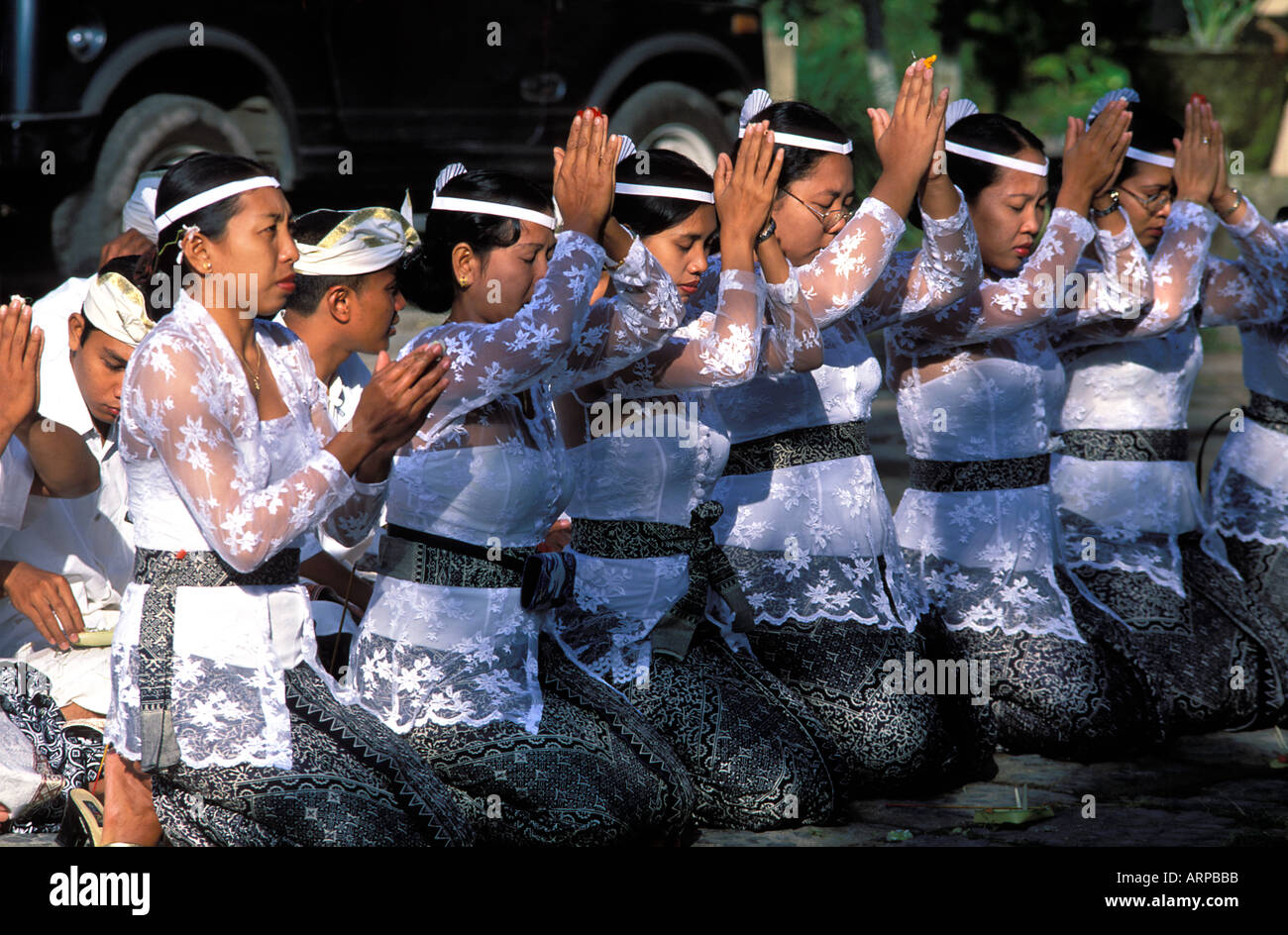 Group of Balinese woman dressed in white at morning prayer Ubud Bali ...