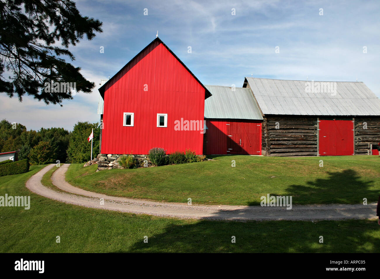 Red Barn A newer red barn joined to an older log barn A rutted laneway ...