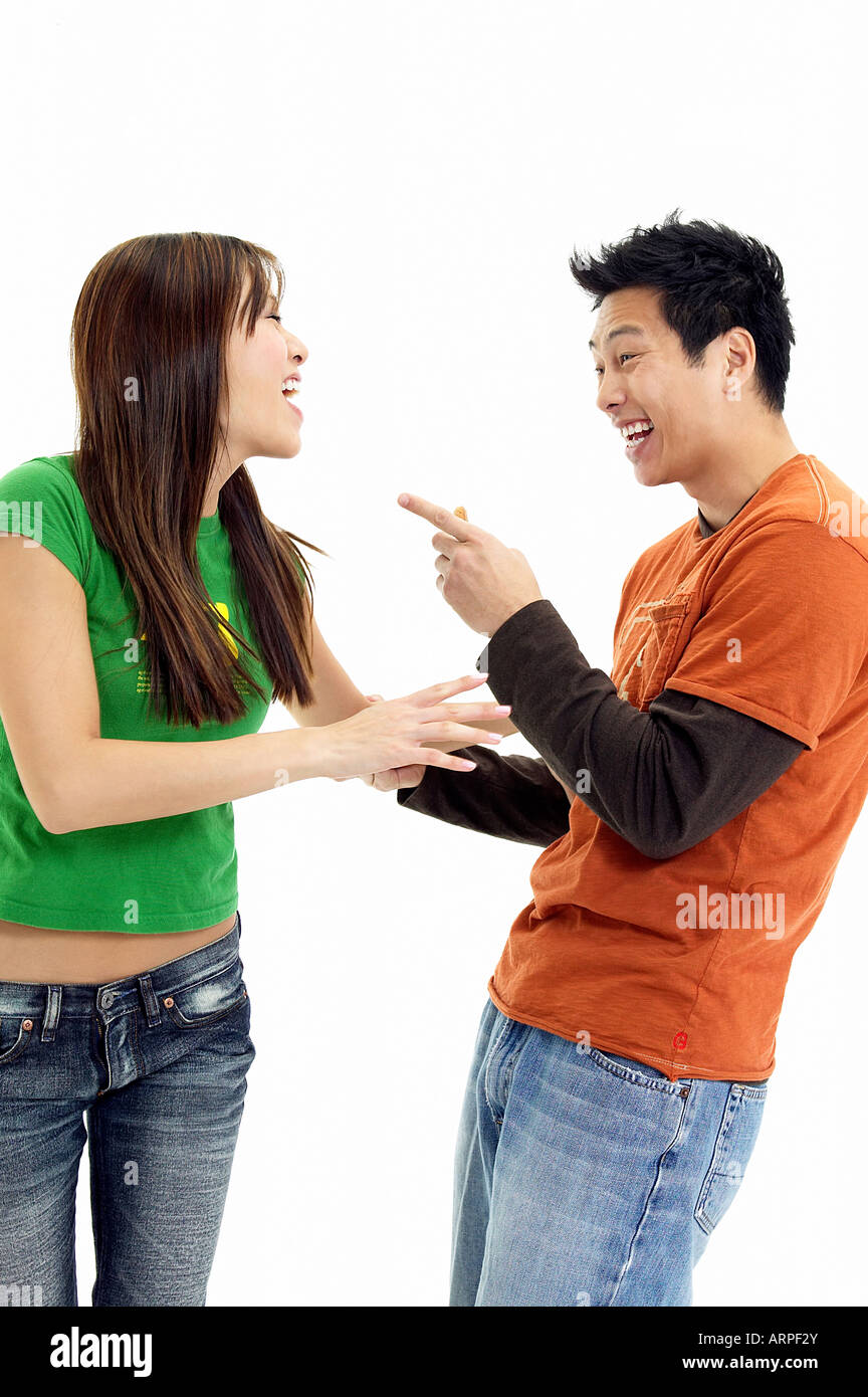 Couple Having Fun, Man Pointing Stock Photo - Alamy