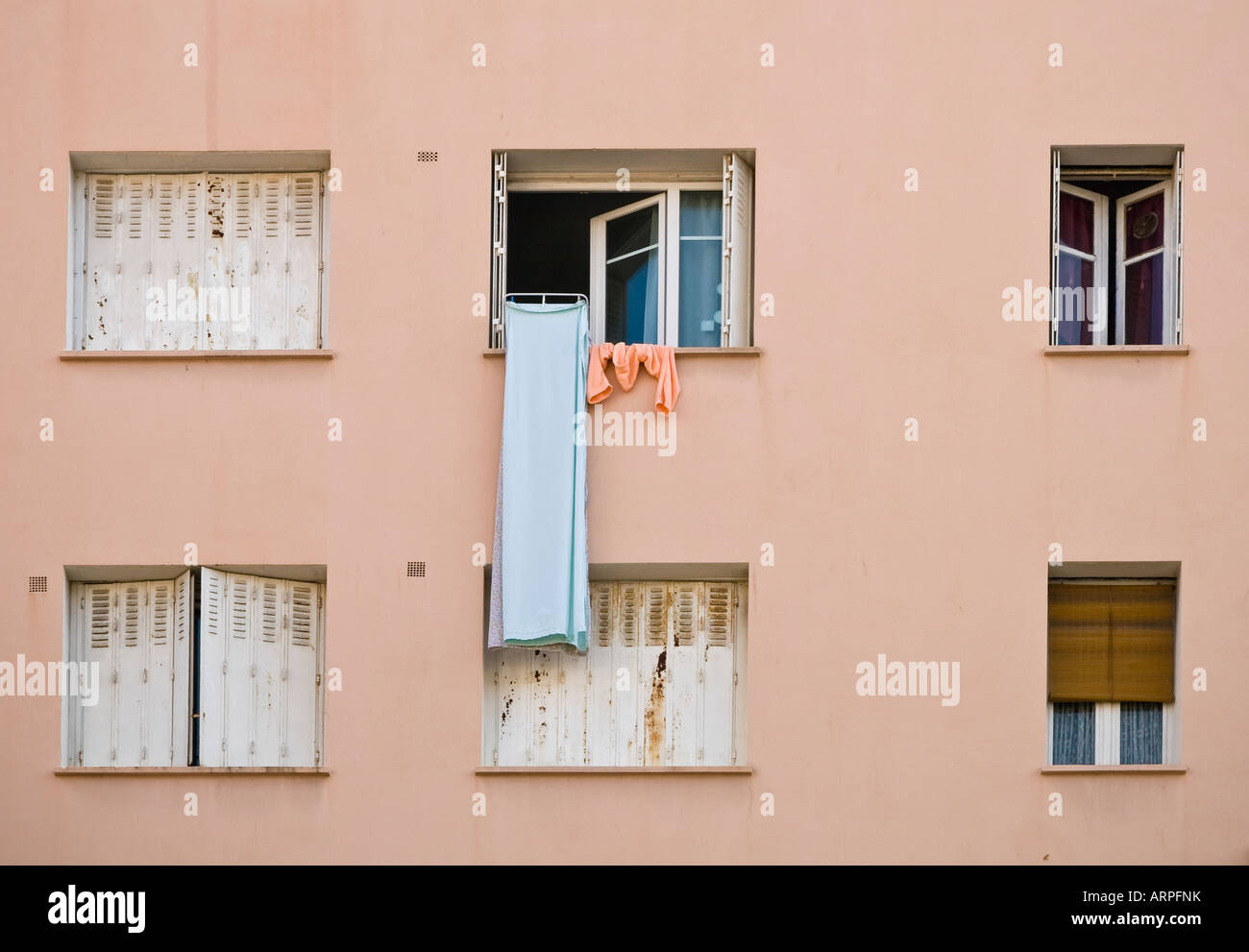 Laundry drying outside windows little resort town Stock Photo - Alamy