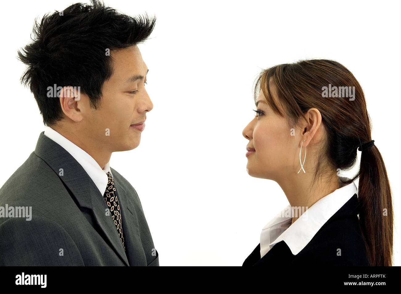 Business Couple Facing Each Other Stock Photo - Alamy