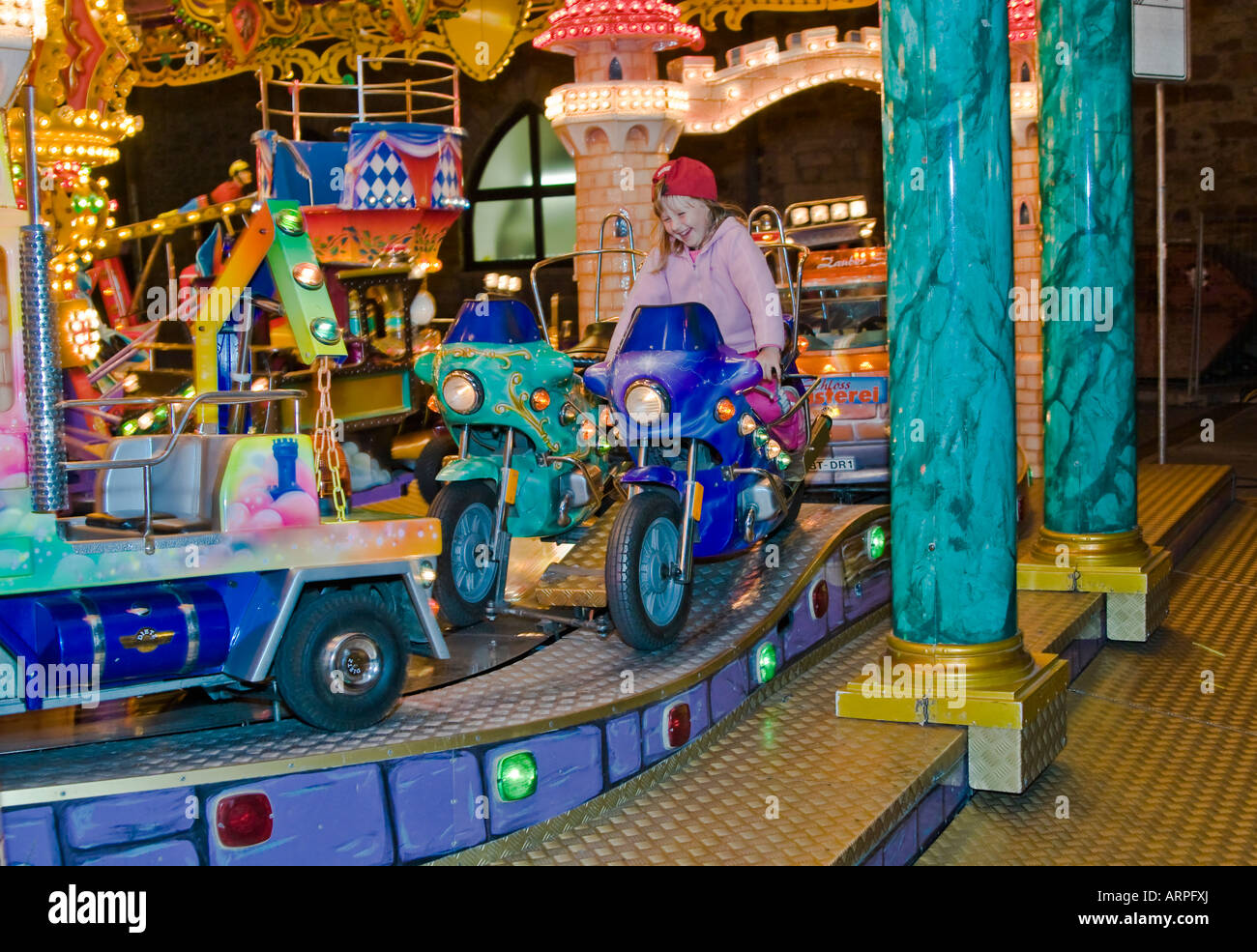 Girl at a fair ride, mid-October harvest celebration in Eastern Germany ...