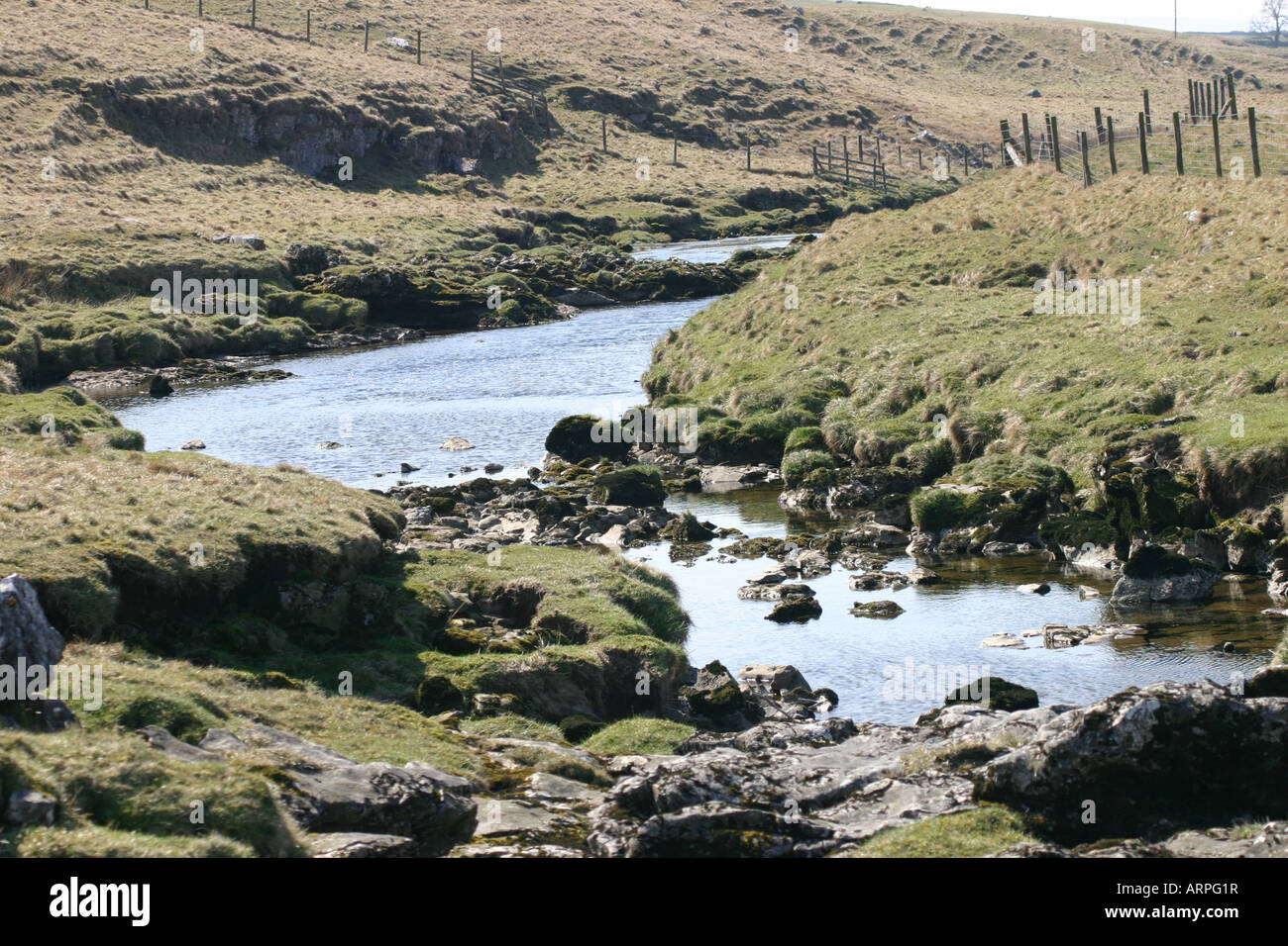 fast flowing valley river stream bed undulating Stock Photo - Alamy