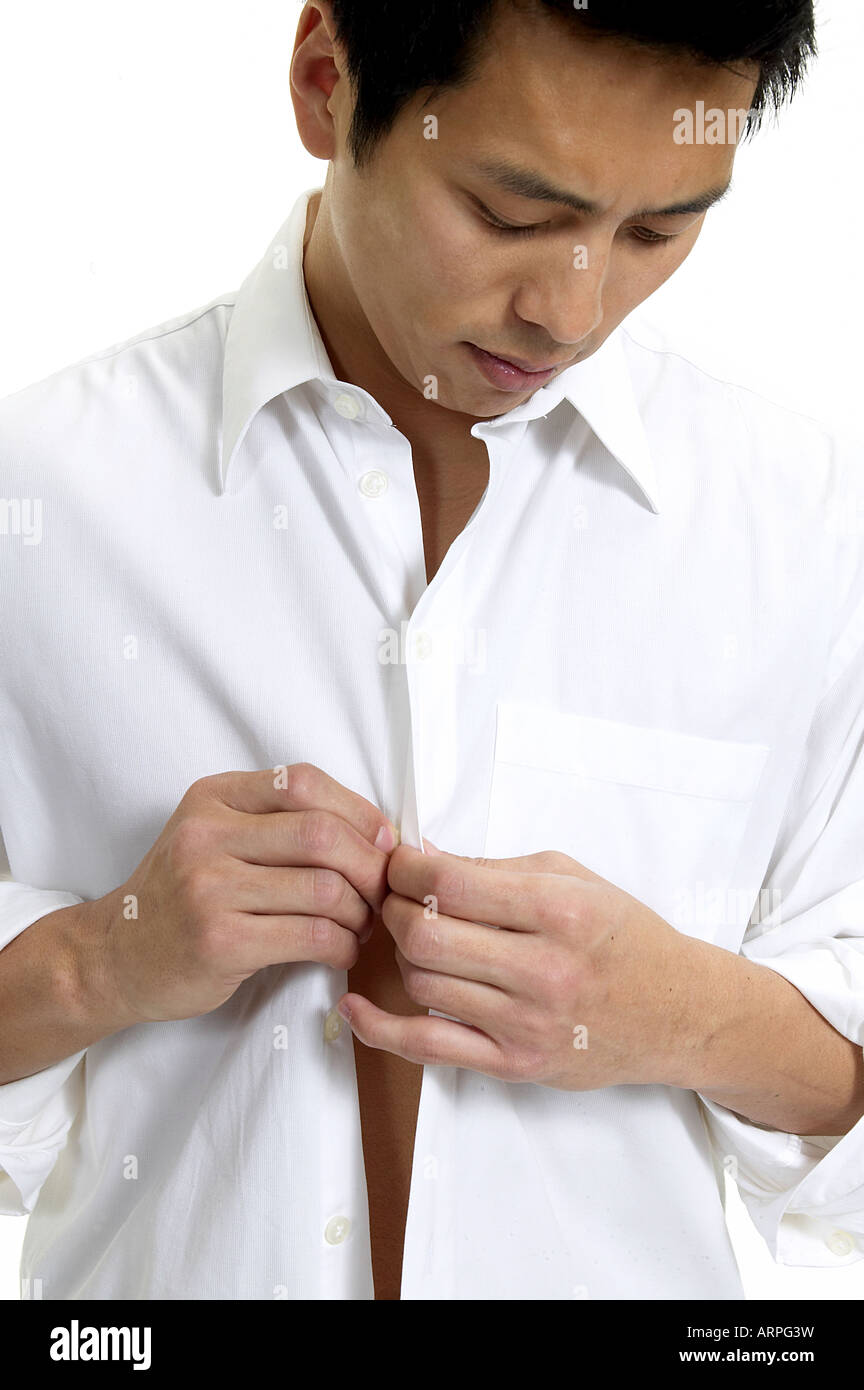 Man Buttoning Up Shirt Stock Photo - Alamy