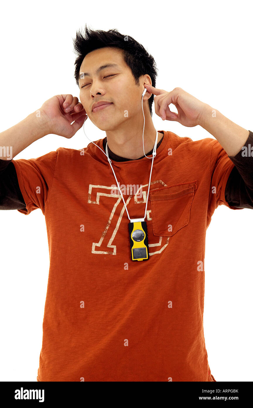 Young Man Listening to mp3 Player Stock Photo - Alamy