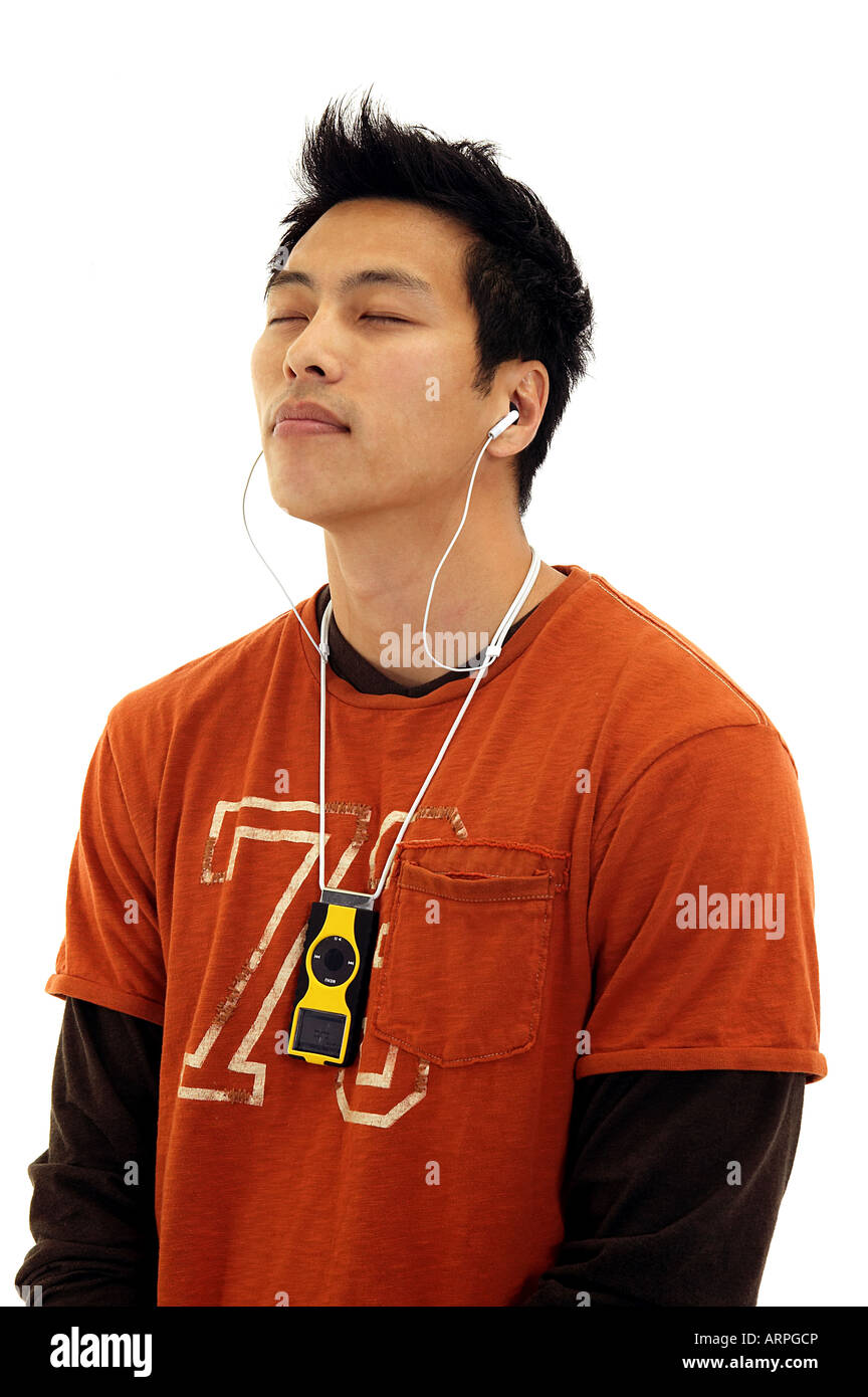 Young Man Listening to mp3 Player Stock Photo - Alamy