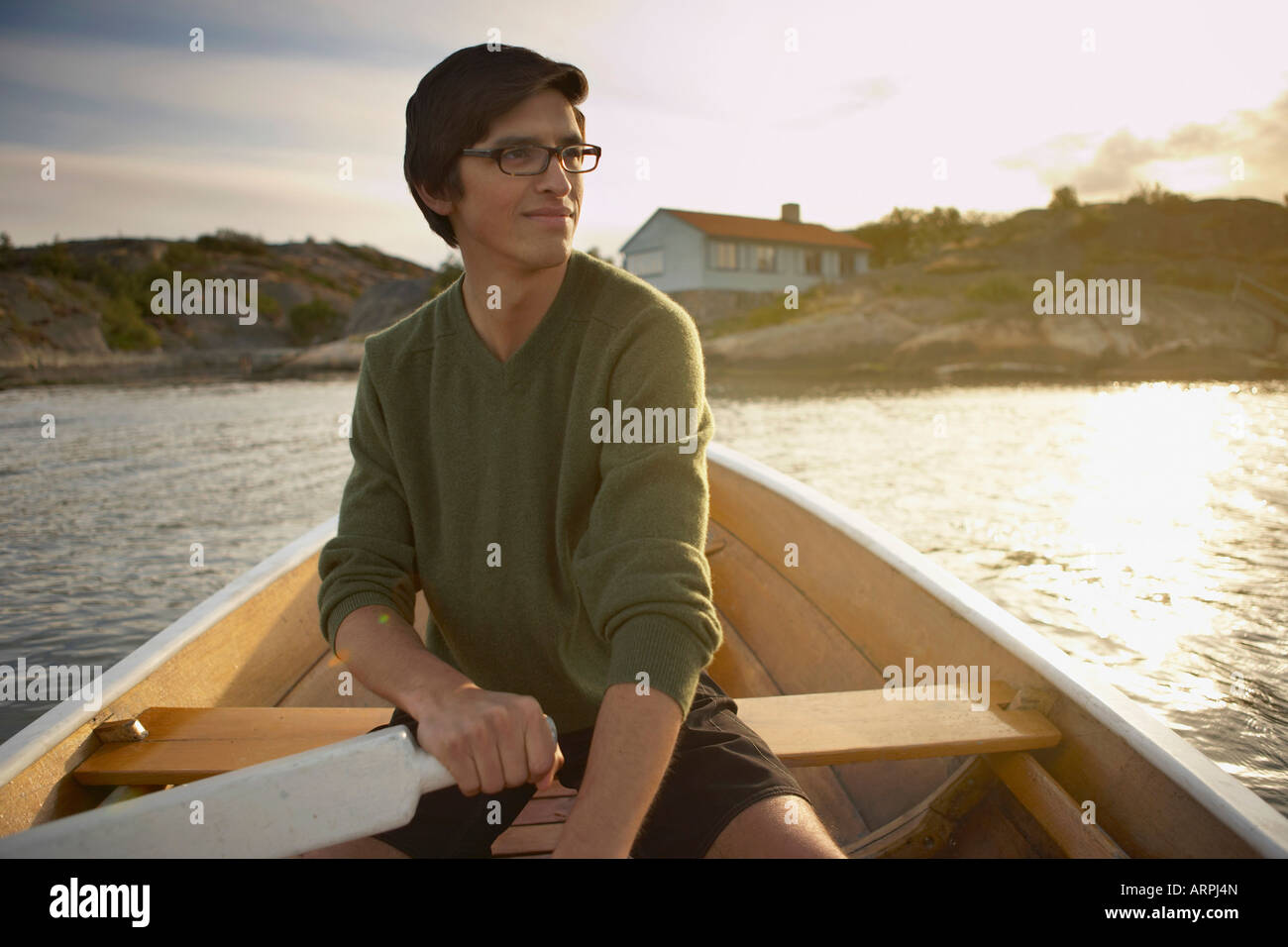 Man with rowing boat hi-res stock photography and images - Alamy