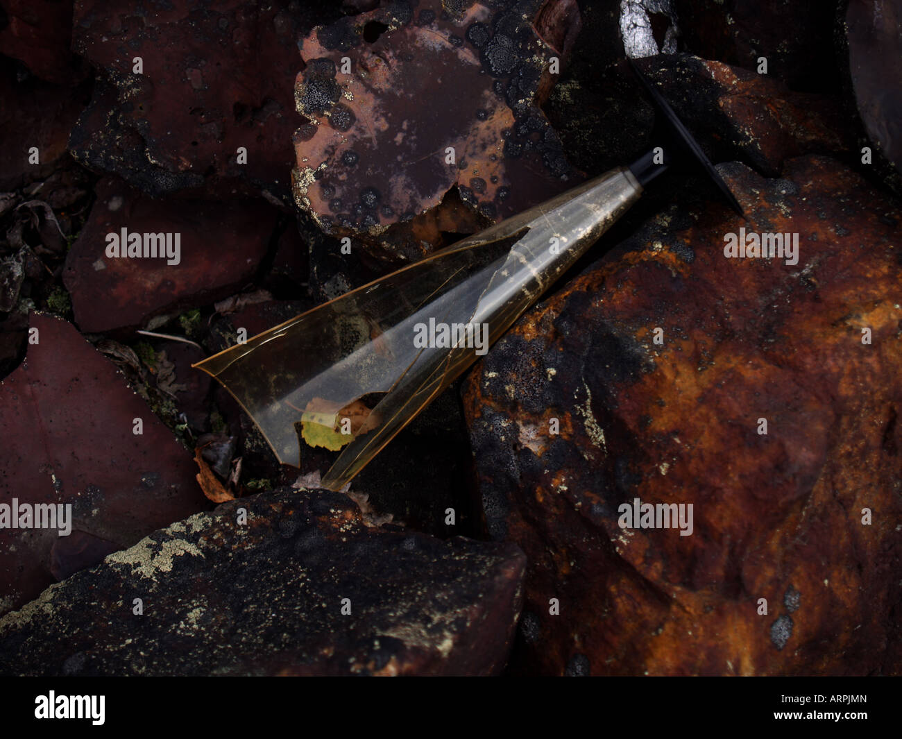 Broken glass on cinder stones Stock Photo - Alamy
