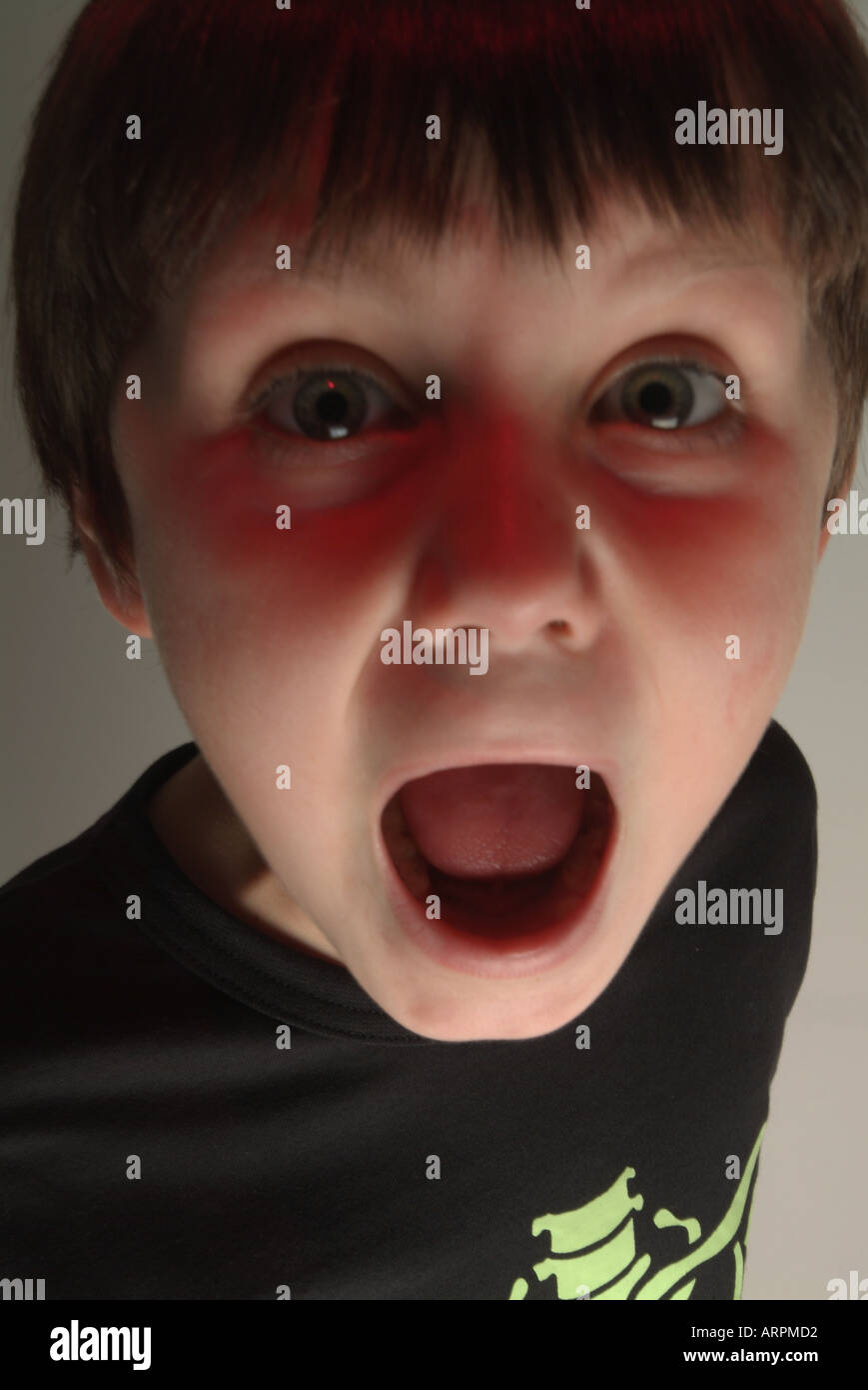 young boy screaming at camera Stock Photo - Alamy