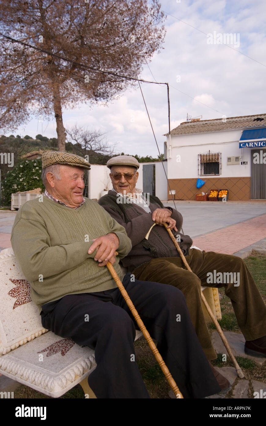 Two older Spanish men enjoying a joke Stock Photo - Alamy