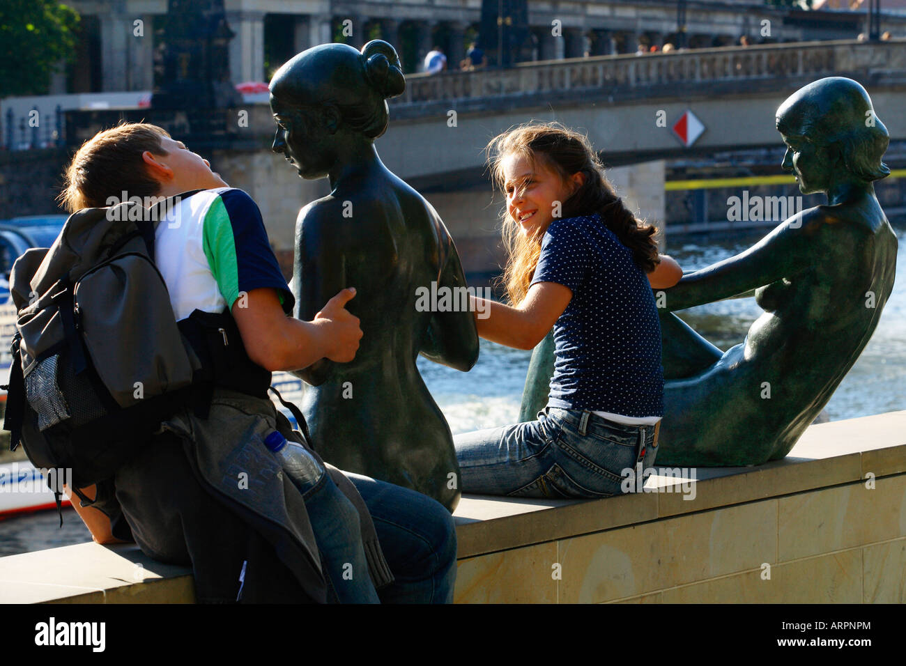 Two children playing with statues near Spree river Berlin Stock Photo ...