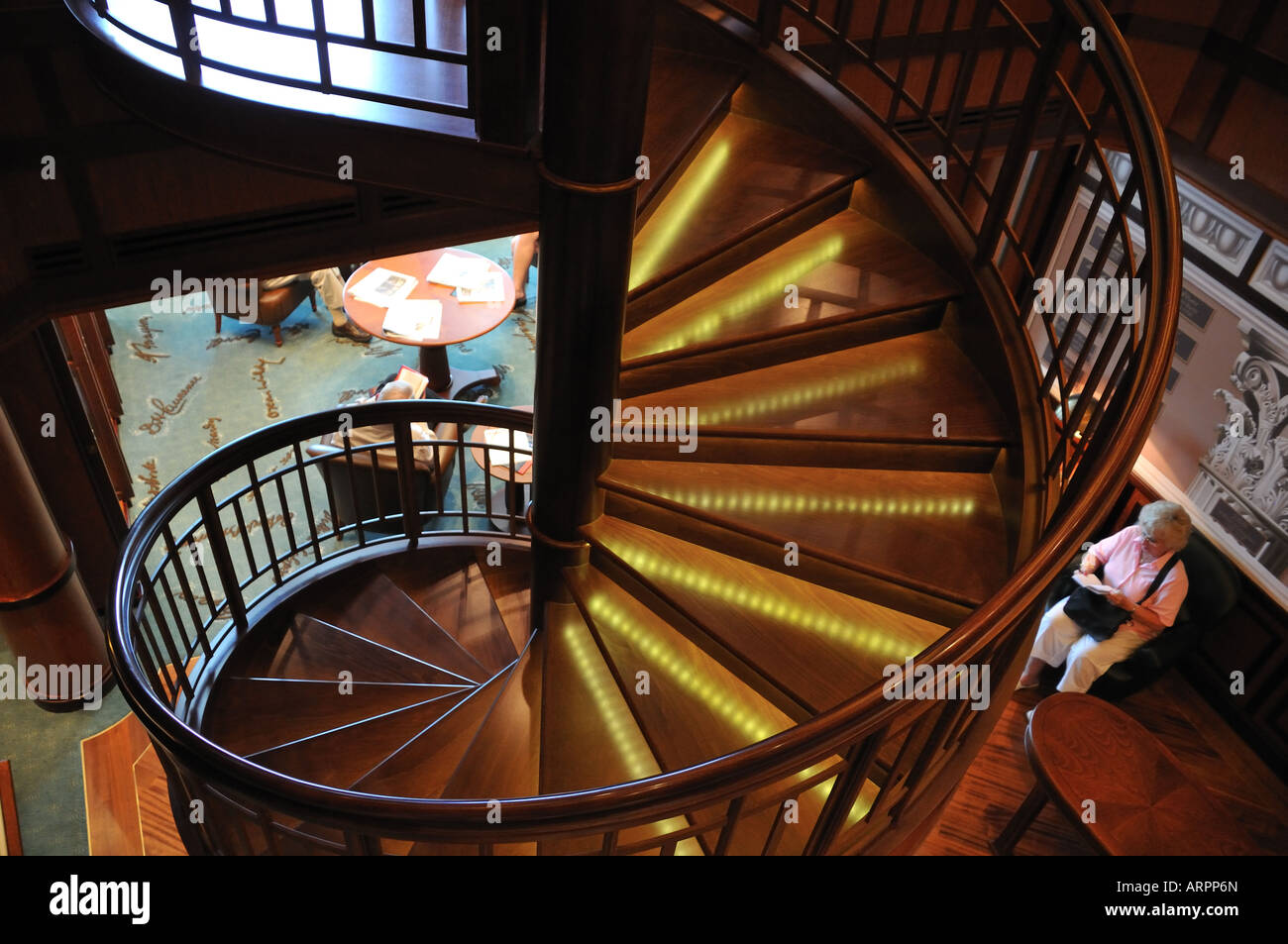 The well-used library on Cunard's cruise ship, Queen Victoria, has a ...