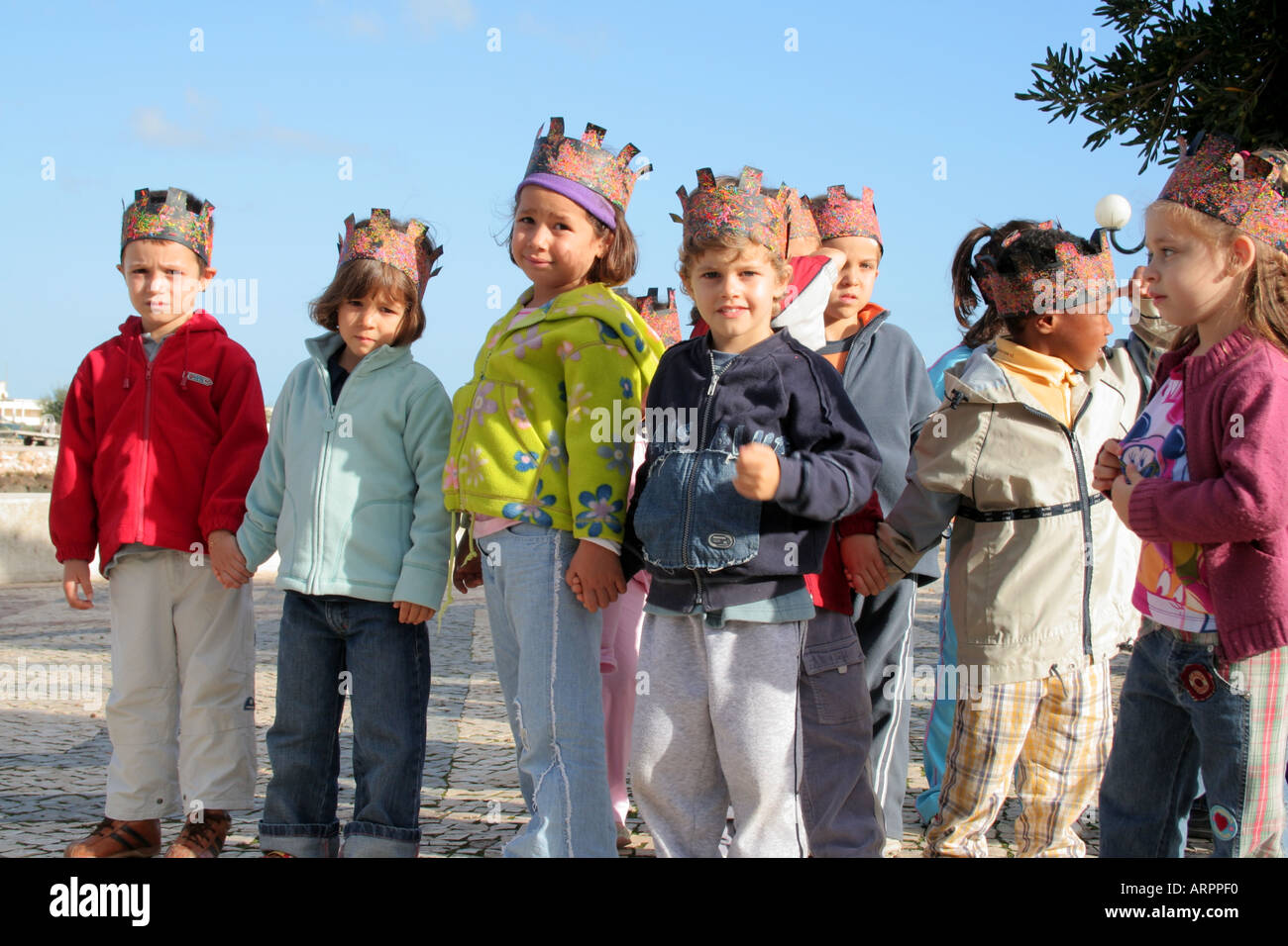 children wearing paper crowns at Historic Parade Festival dos ...