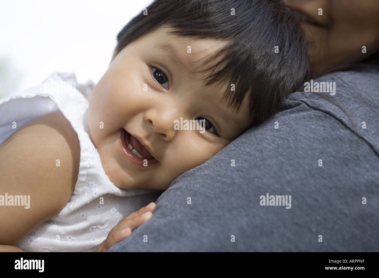 native american toddler hugging parent Stock Photo - Alamy