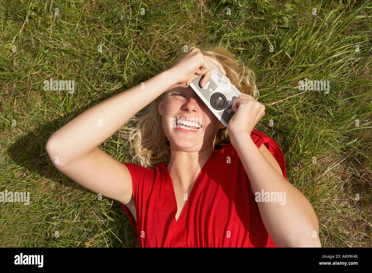 Young woman with fake toy camera Stock Photo - Alamy