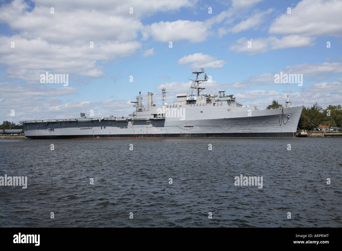 The Austin (LPD 4) Amphibious Transport Dock. At dock across expanse of ...