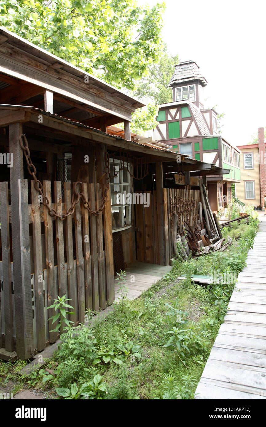 Long narrow wooden walkway beside rustic iron workshop Stock Photo - Alamy