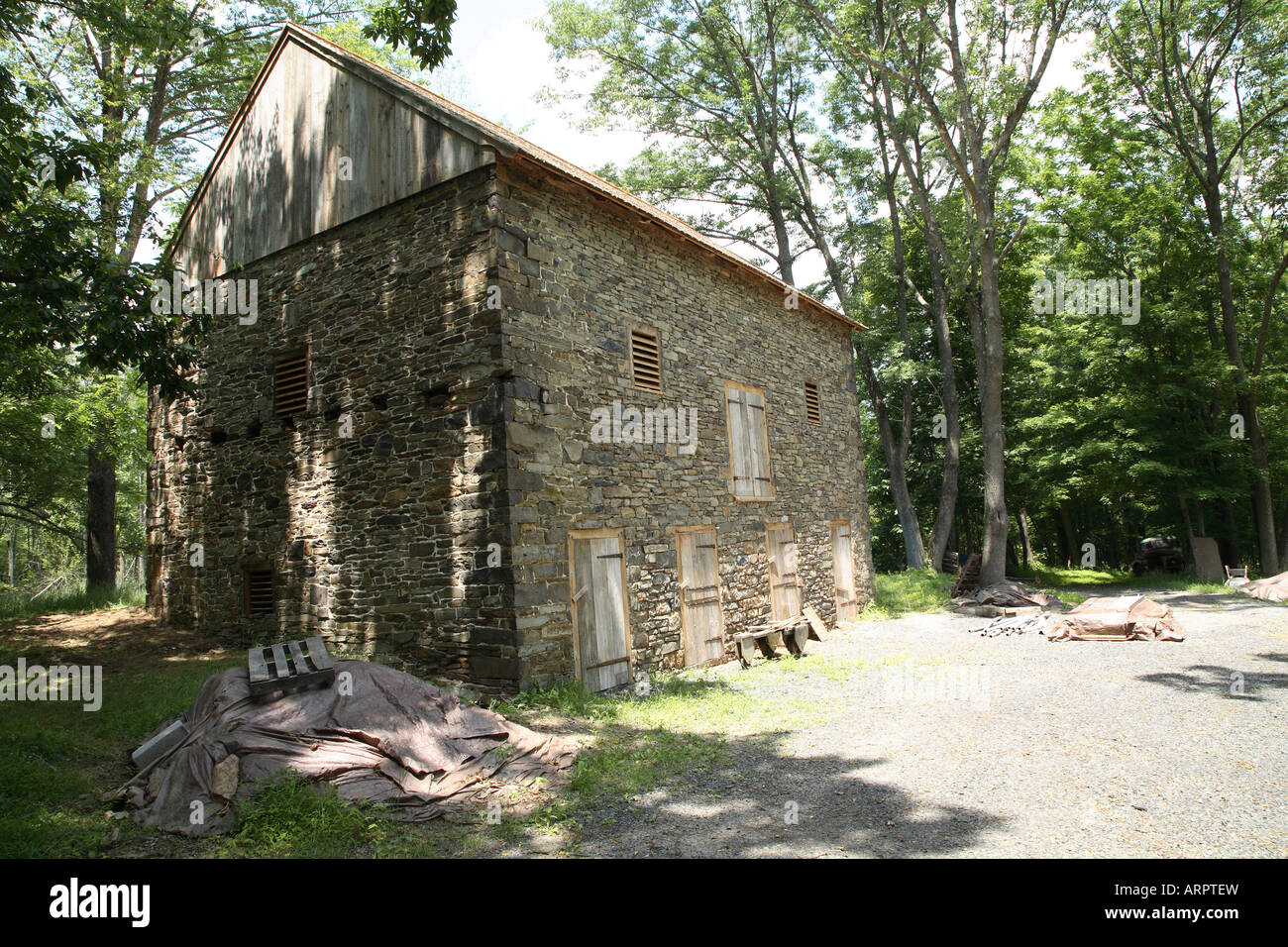 Stone barn with wooden shingled roof Stock Photo - Alamy