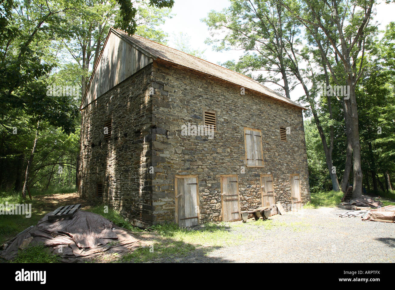Stone barn with wooden shingled roof Stock Photo - Alamy