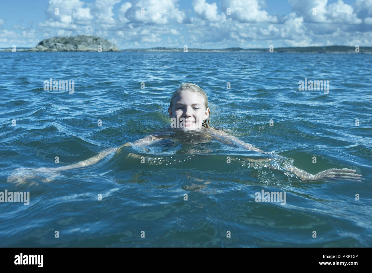 Young Woman Swimming in the Sea Stock Photo - Alamy
