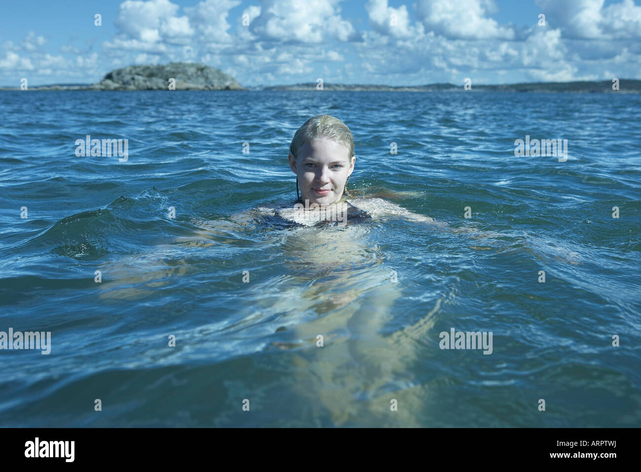 Young Woman Swimming in the Sea Stock Photo - Alamy