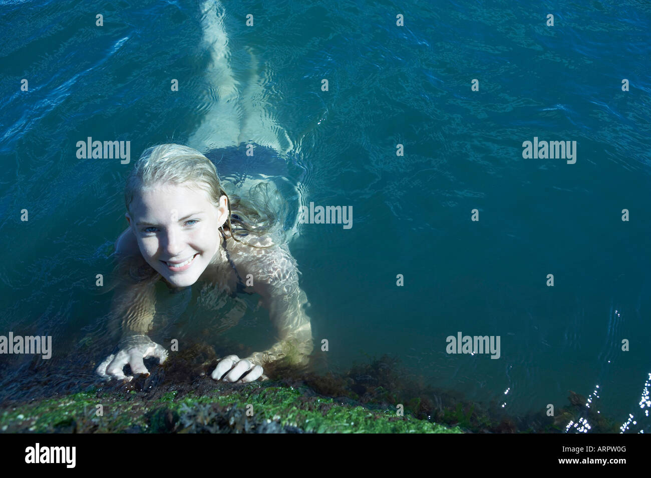 Young Woman Swimming in the Sea Stock Photo - Alamy