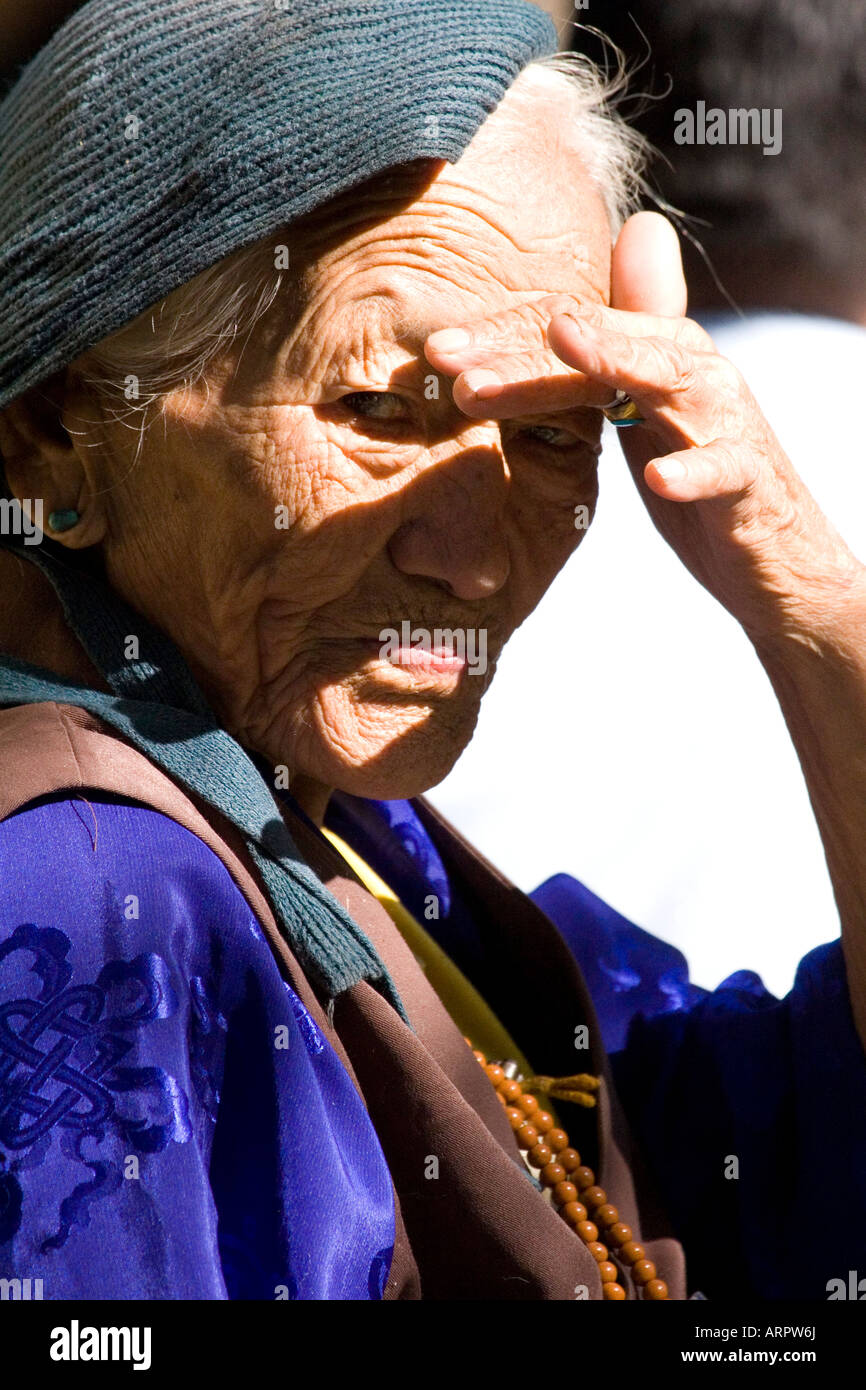 Traditional Tibetan woman shielding her face Stock Photo - Alamy
