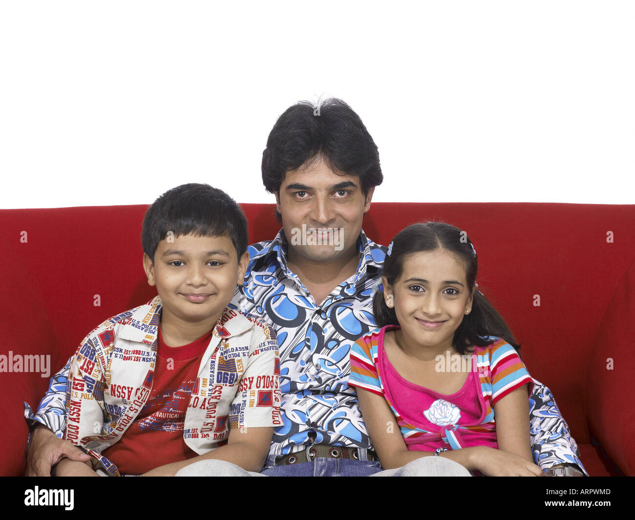 VDA200188 South Asian Indian father with son and daughter sitting on ...