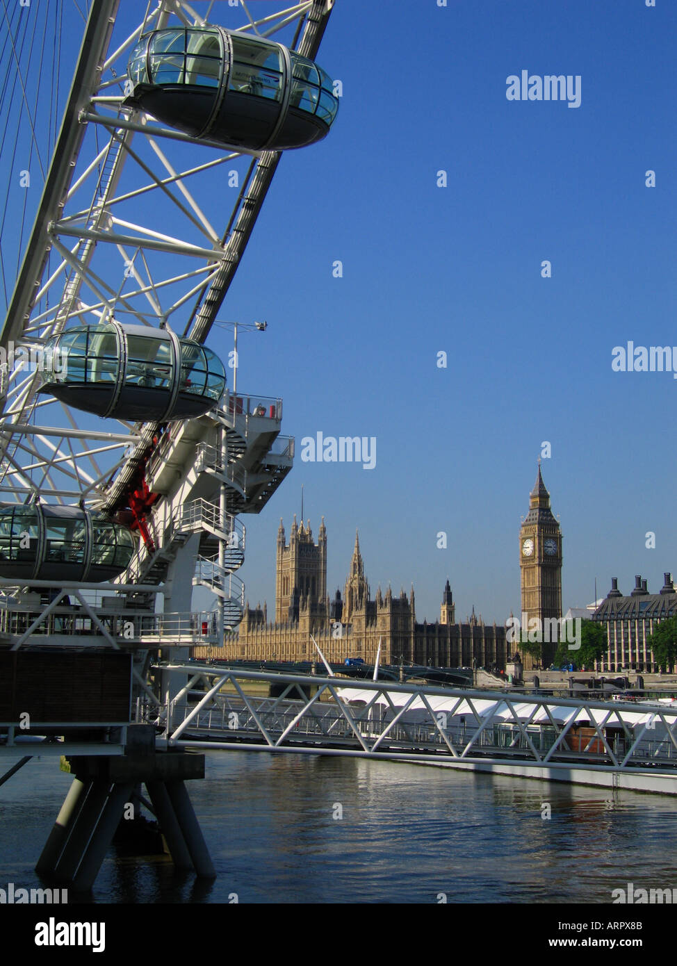 London Eye millennium Wheel with Big Ben and Houses of Parliament in ...