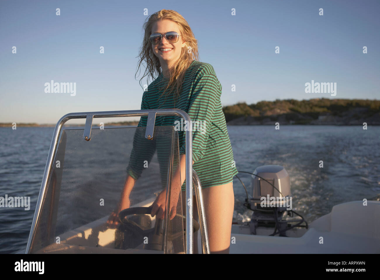 Young Woman in speedboat Stock Photo - Alamy