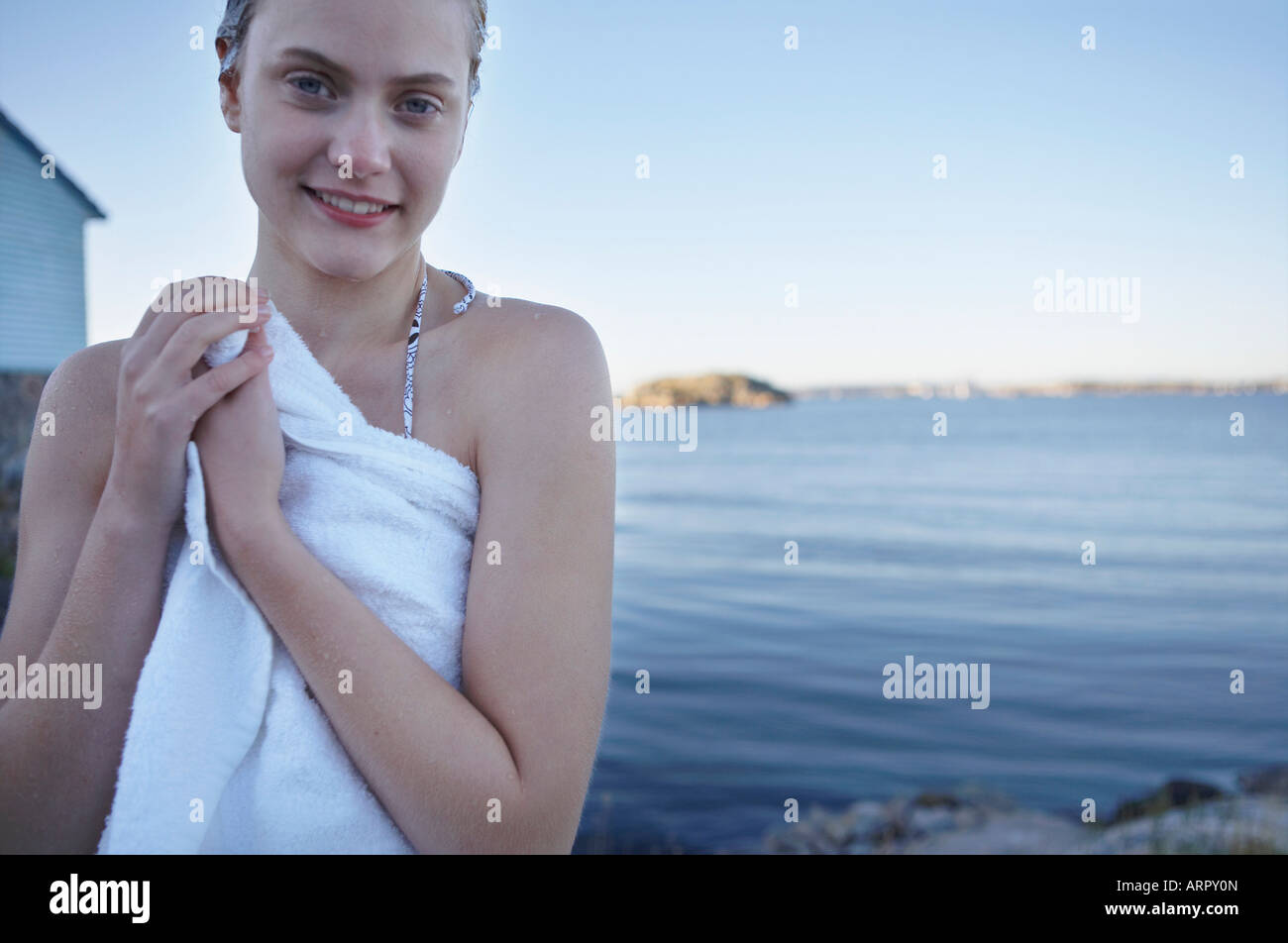 Young woman wearing towel Stock Photo - Alamy