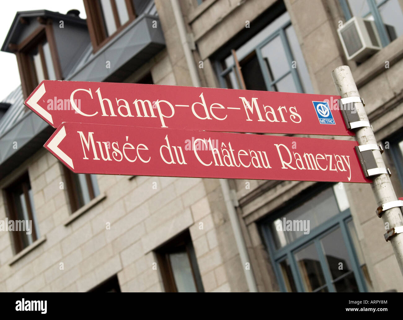 A street sign pointing to the Musee to Chateau Ramezay and Champ de ...