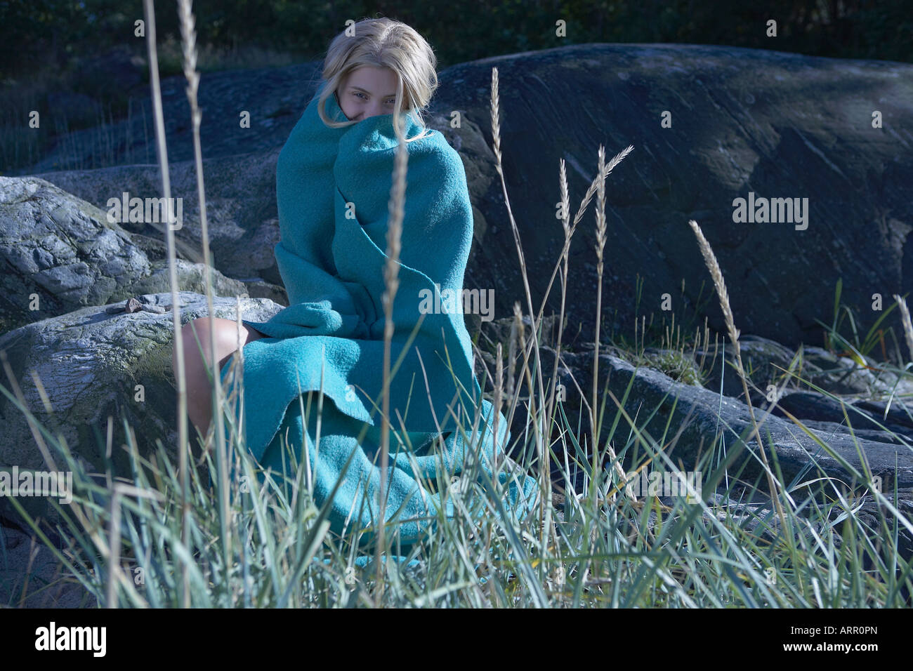 Young Woman wrapped in blanket Stock Photo - Alamy