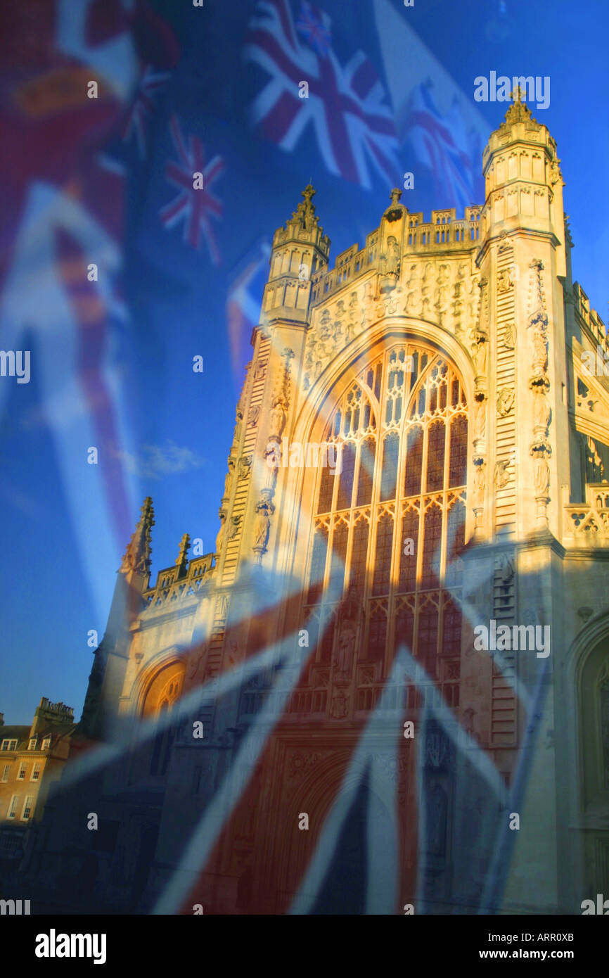 Bath Abbey reflected in a shop window displaying Union Jack flags Stock ...
