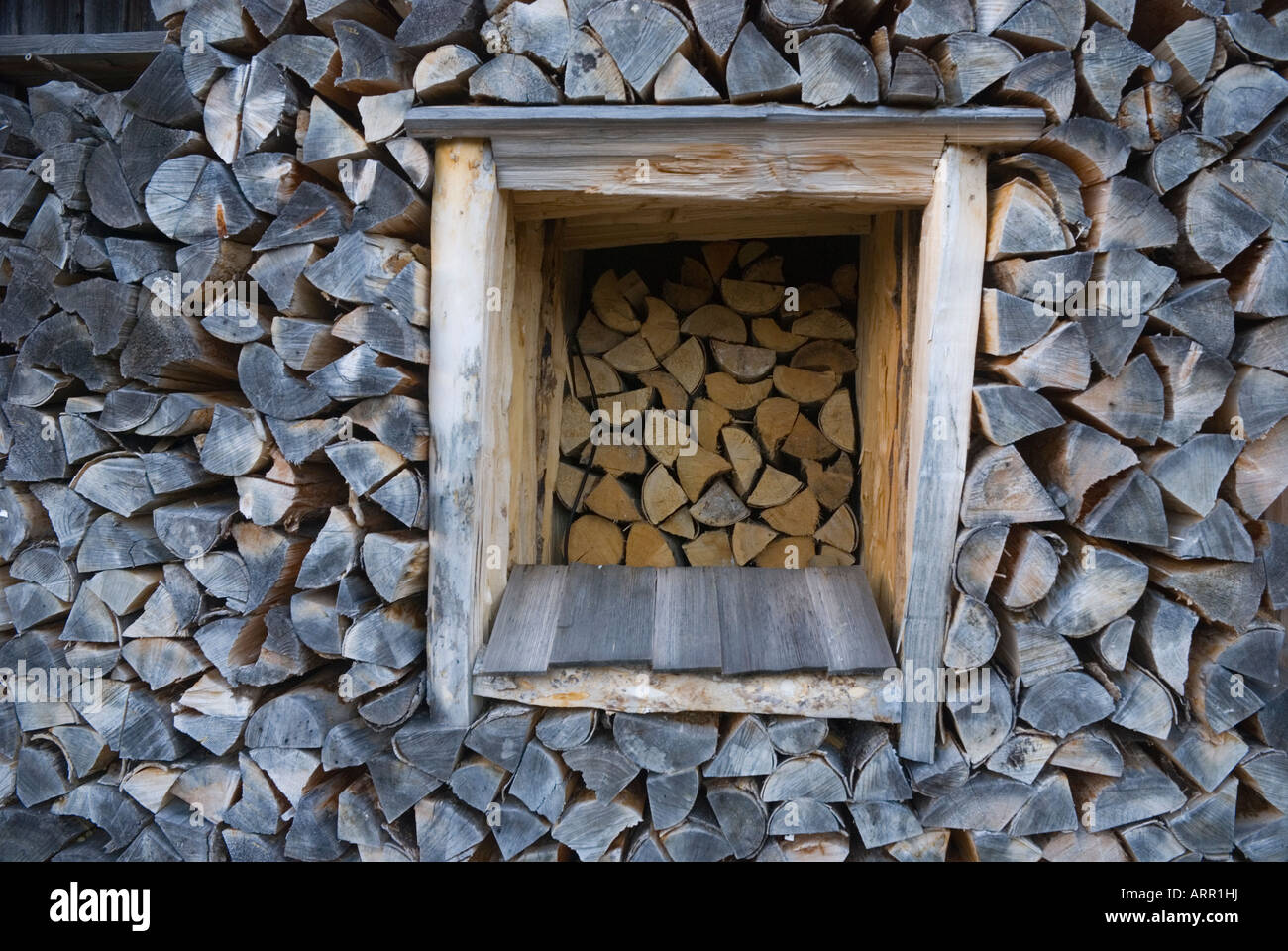 Wood log store in a village in Switzerland Stock Photo - Alamy