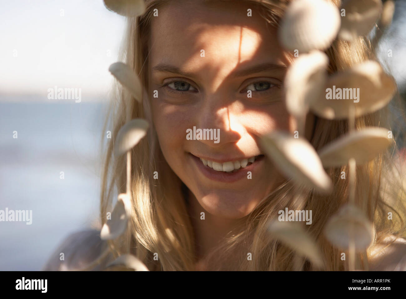 Young Woman portrait with sea shells Stock Photo - Alamy