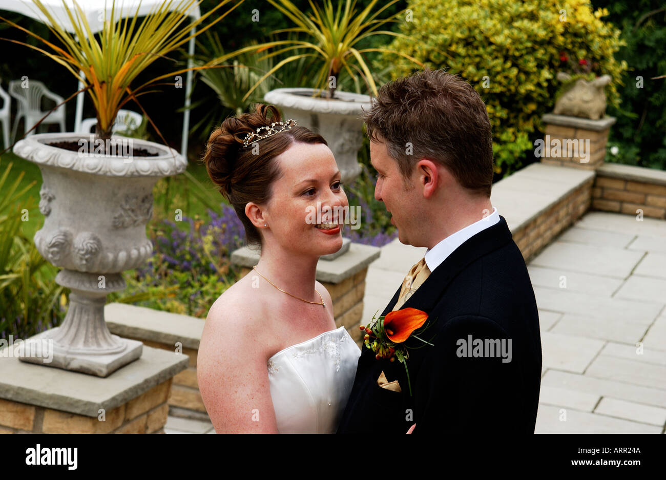bride and groom holding each other on wedding day Stock Photo - Alamy