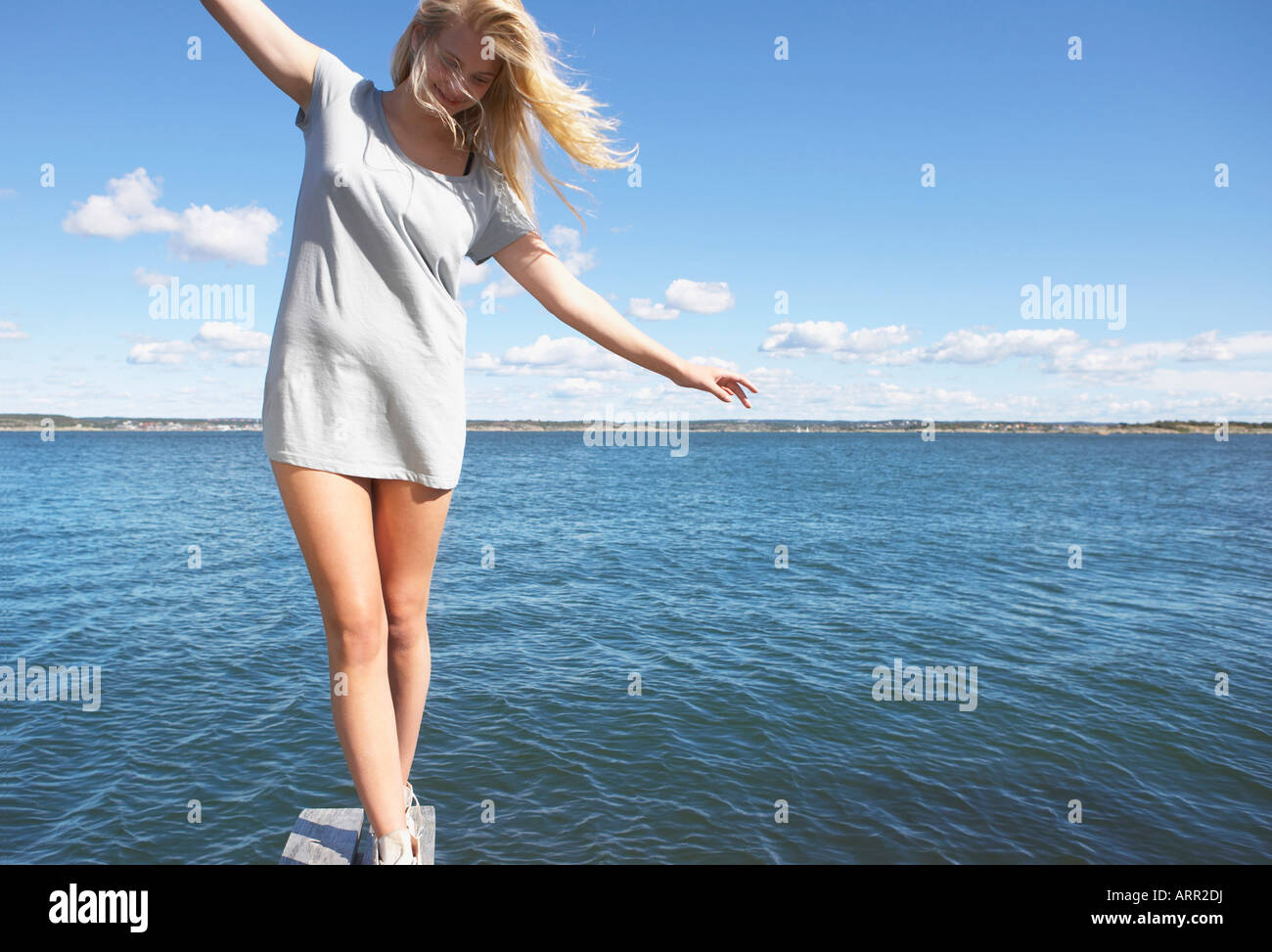 Young woman on diving platform Stock Photo - Alamy