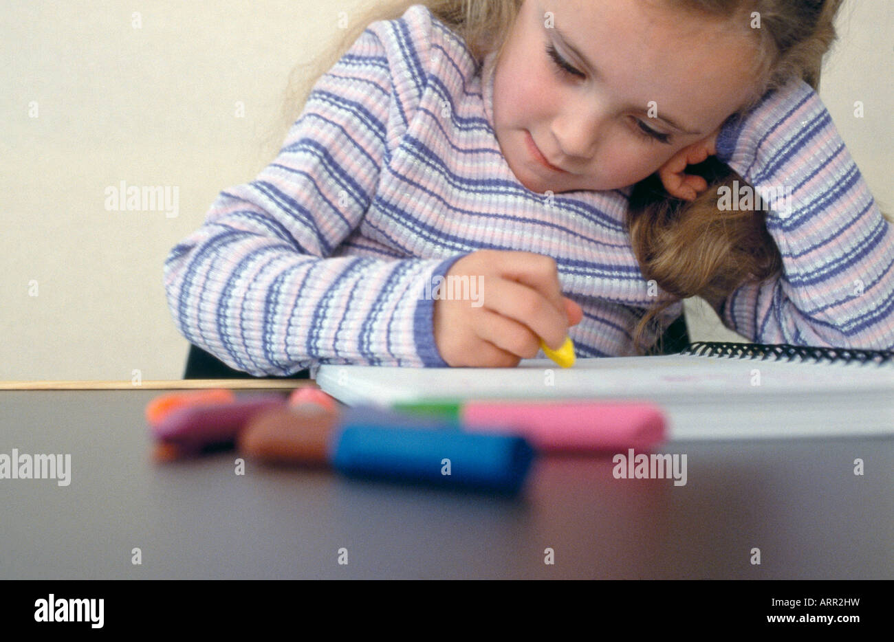 Young Girl with colouring book Stock Photo - Alamy