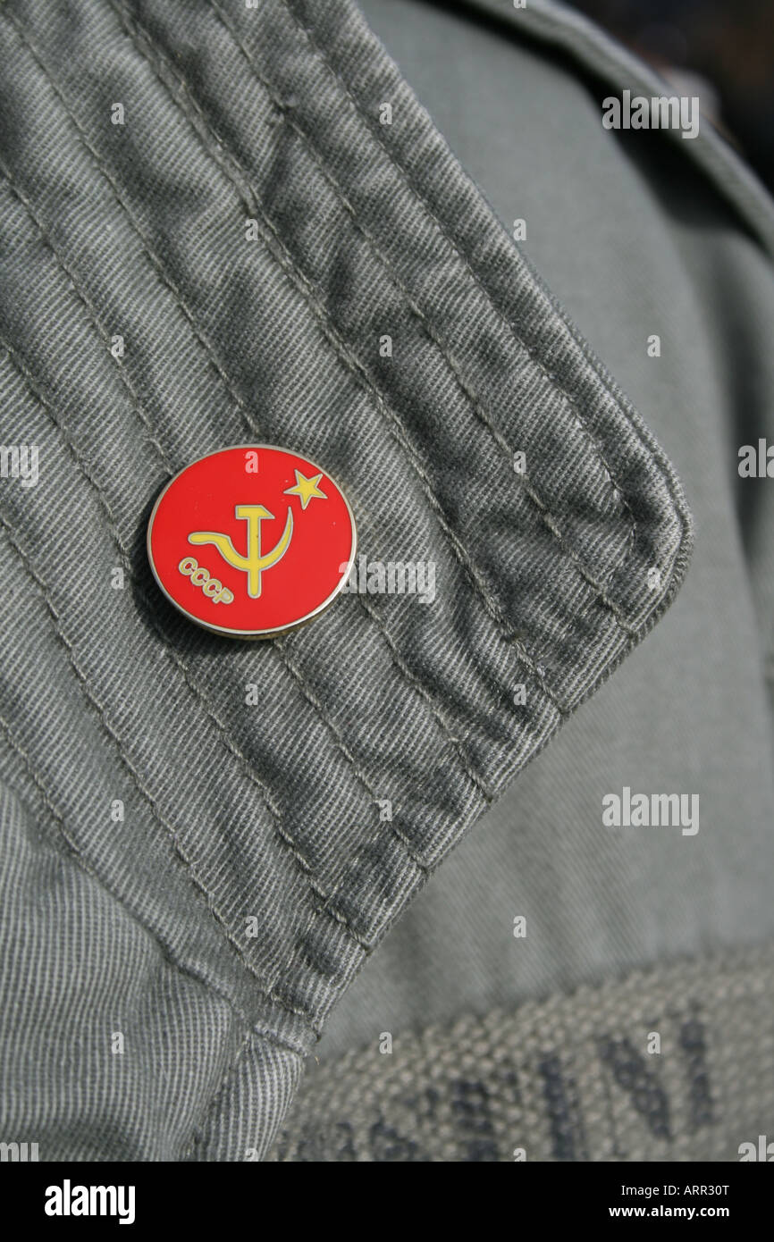 man wearing communist badge Stock Photo - Alamy